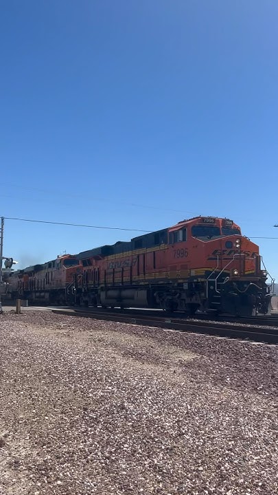 BNSF 7996 leads a westbound stack train through Dagget - YouTube