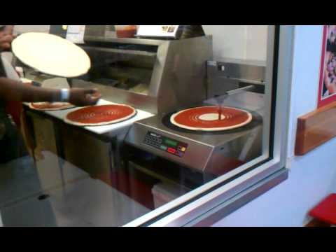 Costco's automatic pizza saucer, very cool! - YouTube