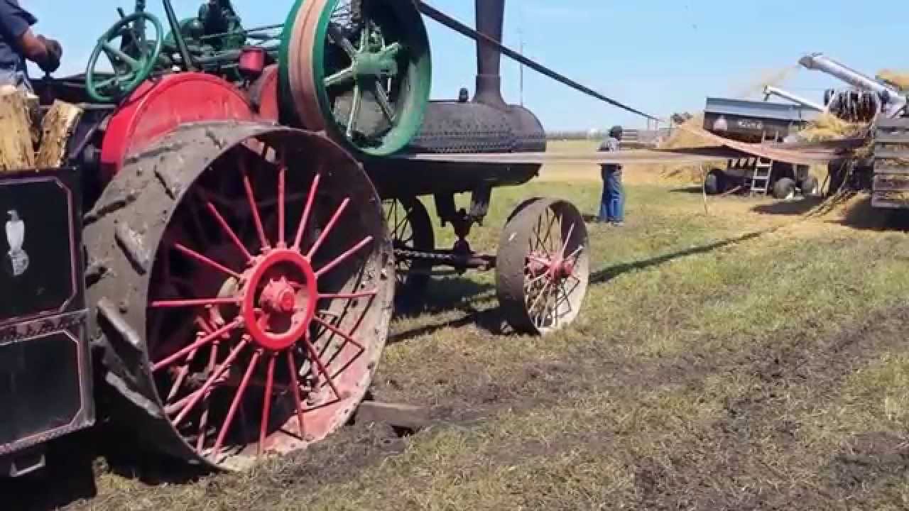 Charles City 2014 50HP Case on Huber threshing machine - YouTube