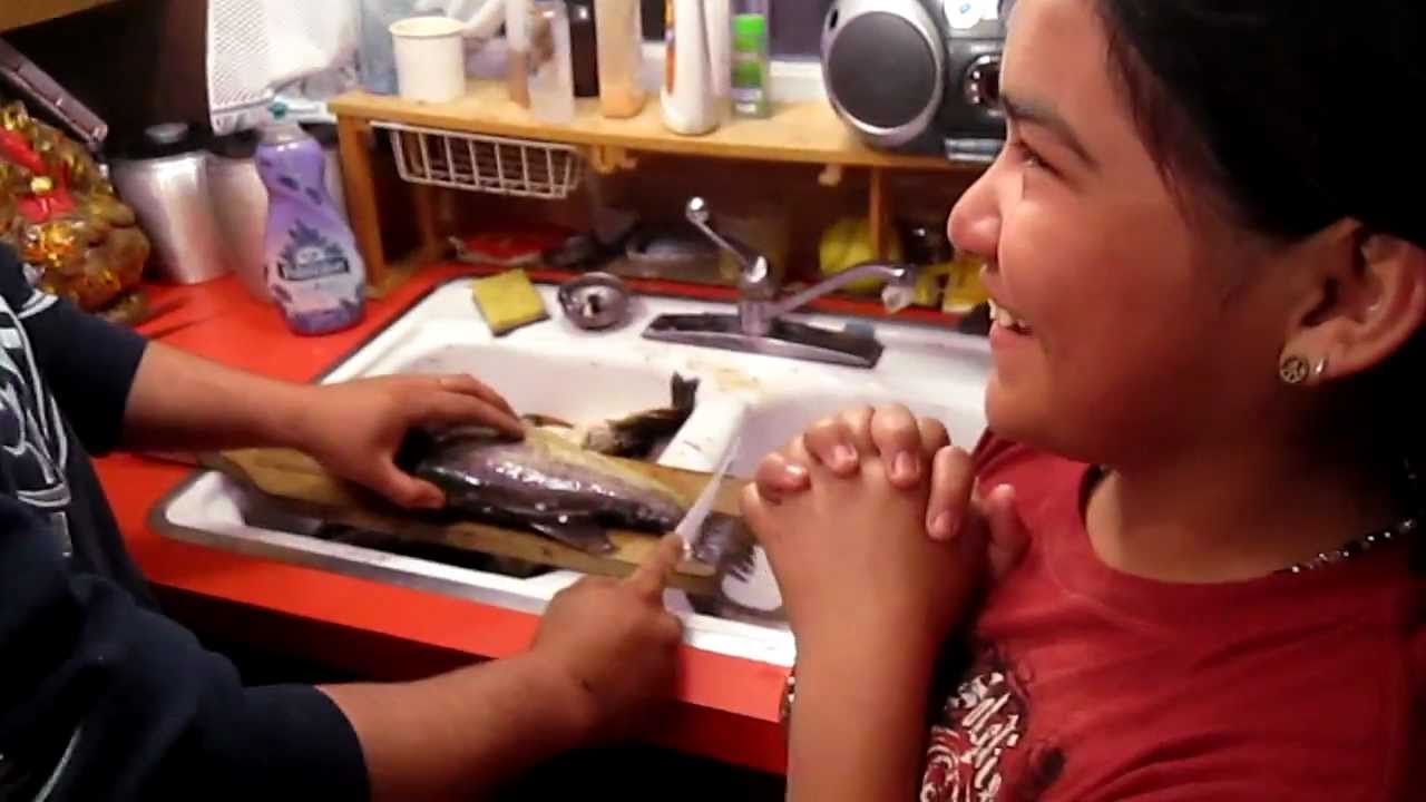 girl cries over fish getting fillet - YouTube