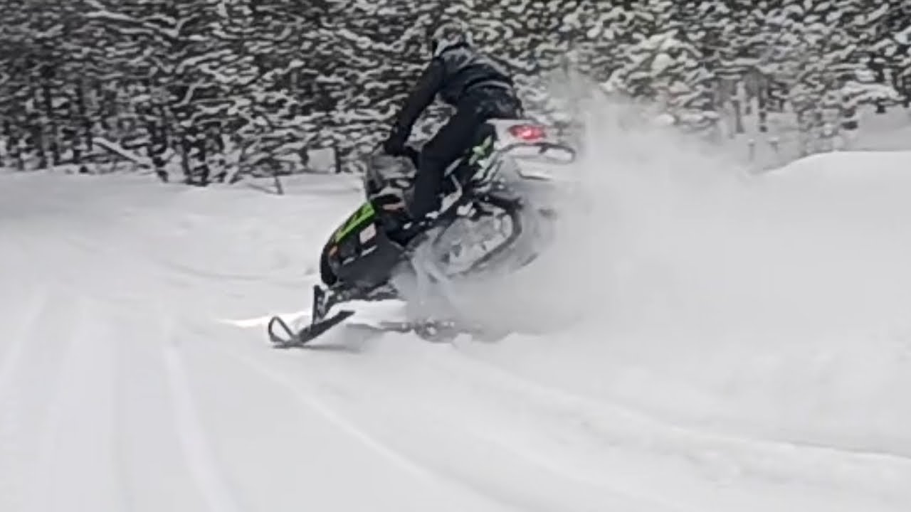 Kid Almost crashes his sled into the trees after jumping it. - YouTube