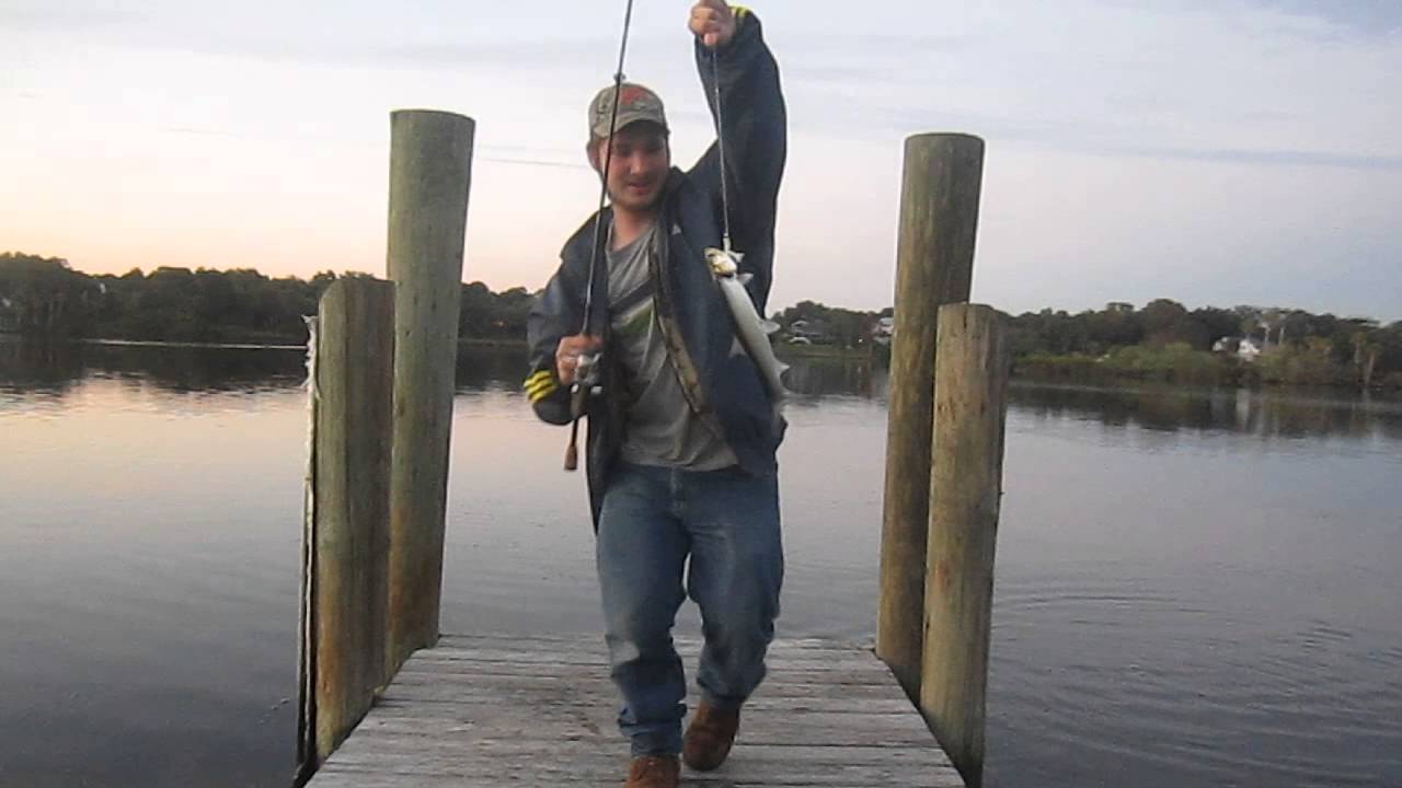 Young country boy fishing: winter fishing for ladyfish. caught ten fish ...