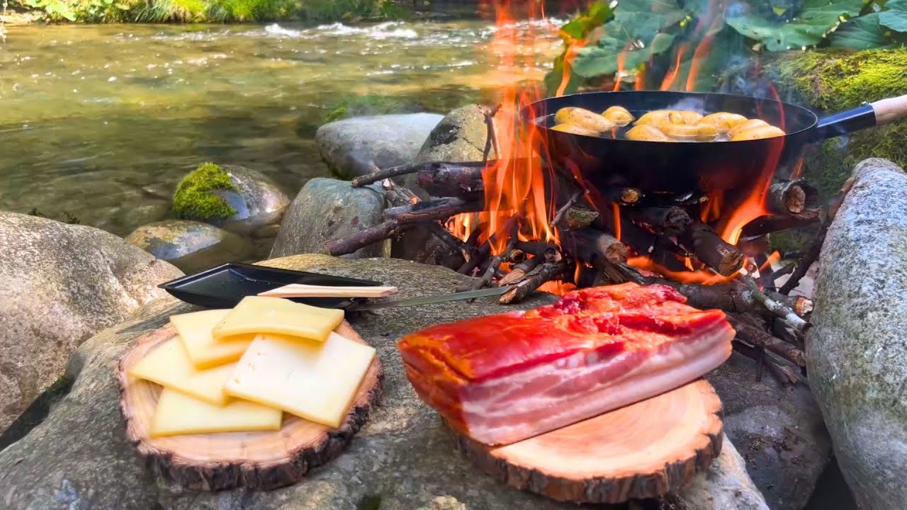 Swiss raclette prepared by a Swiss man with Swiss cheese in Switzerland ...