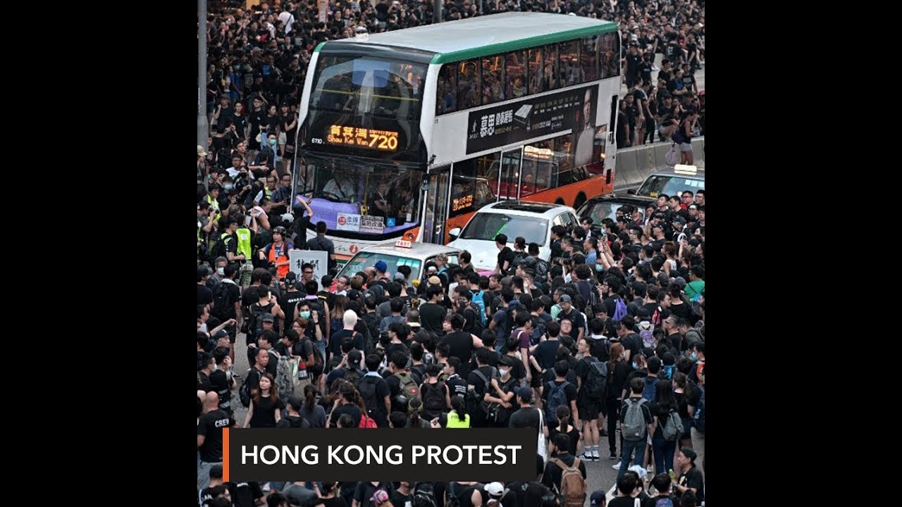 Protesters control key roads after historic Hong Kong rally - YouTube