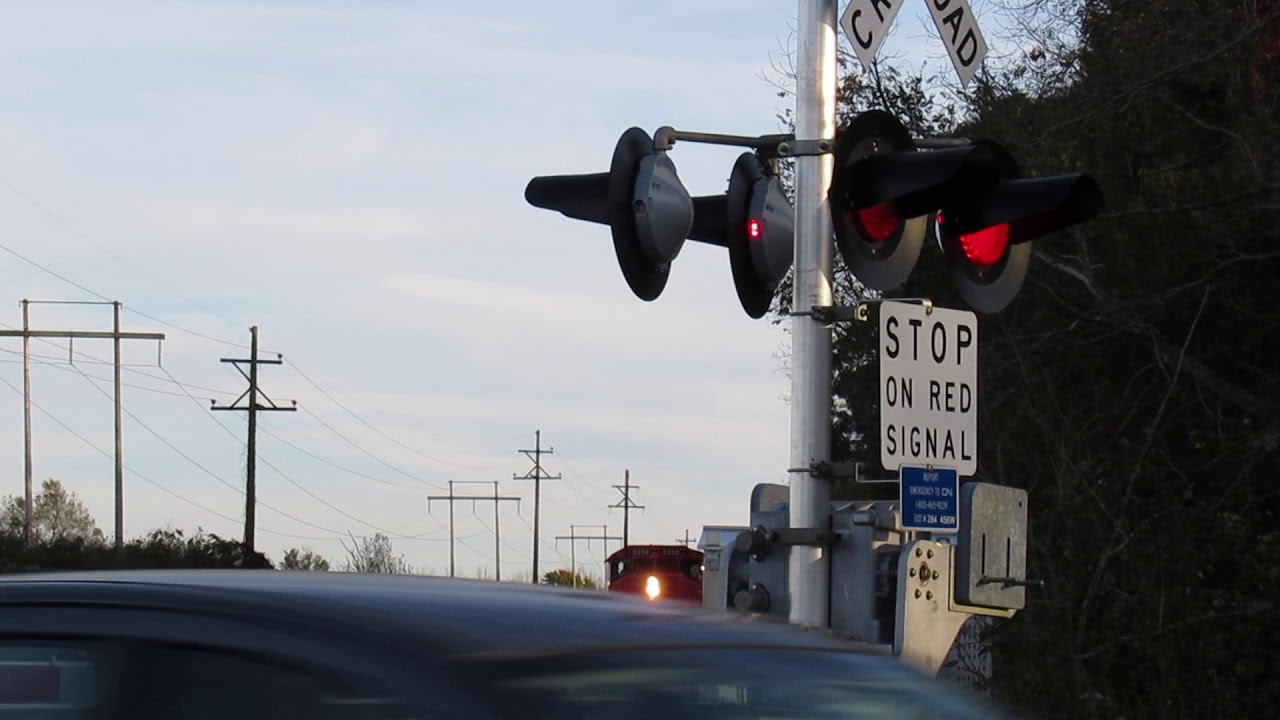 CN 5258 with a local freight train waiting at the grade crossing until ...