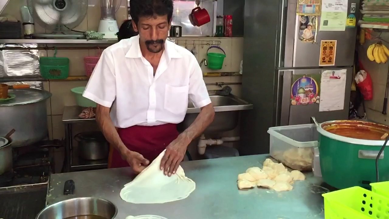Singapore roti prata flipping master, slo-mo - YouTube