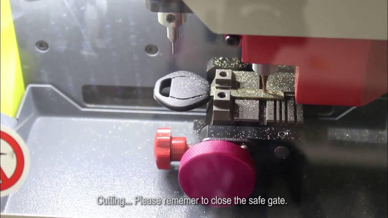 How to cut a BMW HU92 car key by key blank operate with touch screen ...