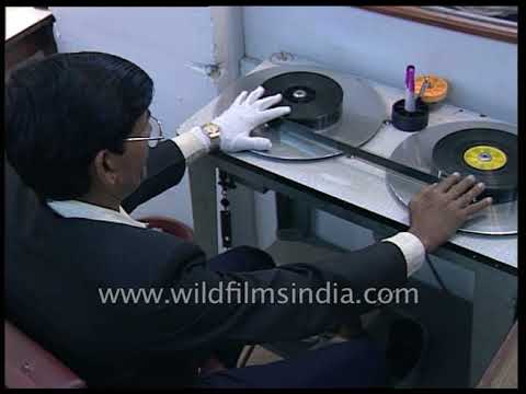 35 mm film being spliced on a Steenbeck table, film reels being ...