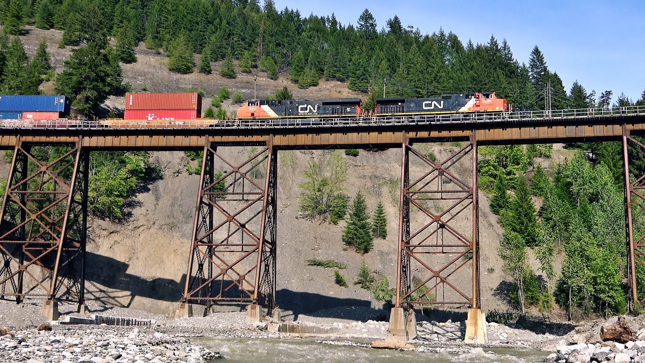 Busy Afternoon Of Massive Canadian Freight Trains Over Curved Railroad ...