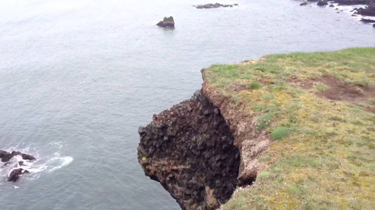 Brad on Icelandic (hafnaberg) cliffs - YouTube