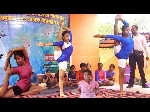 13 to 16 year girls performing 3 yoga asanas in a state level yoga championship at Bagnan