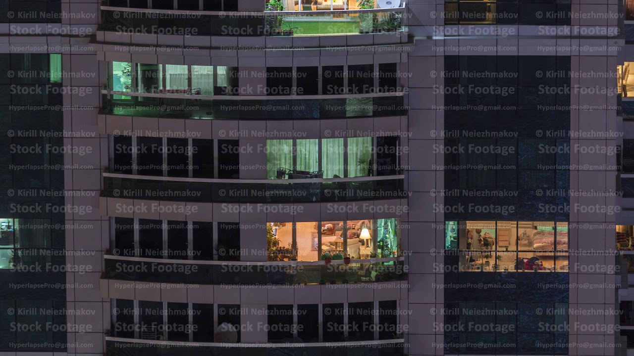 Night view of exterior apartment building timelapse. High rise ...