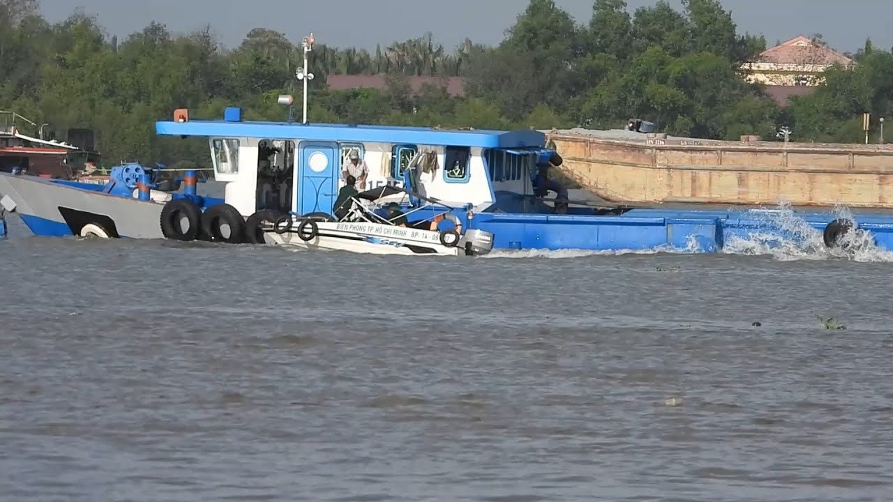 Overloaded Cargo Ship Checked by Police Canoe - YouTube