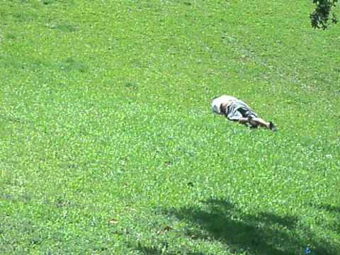 Funny guy rolling down hill - YouTube