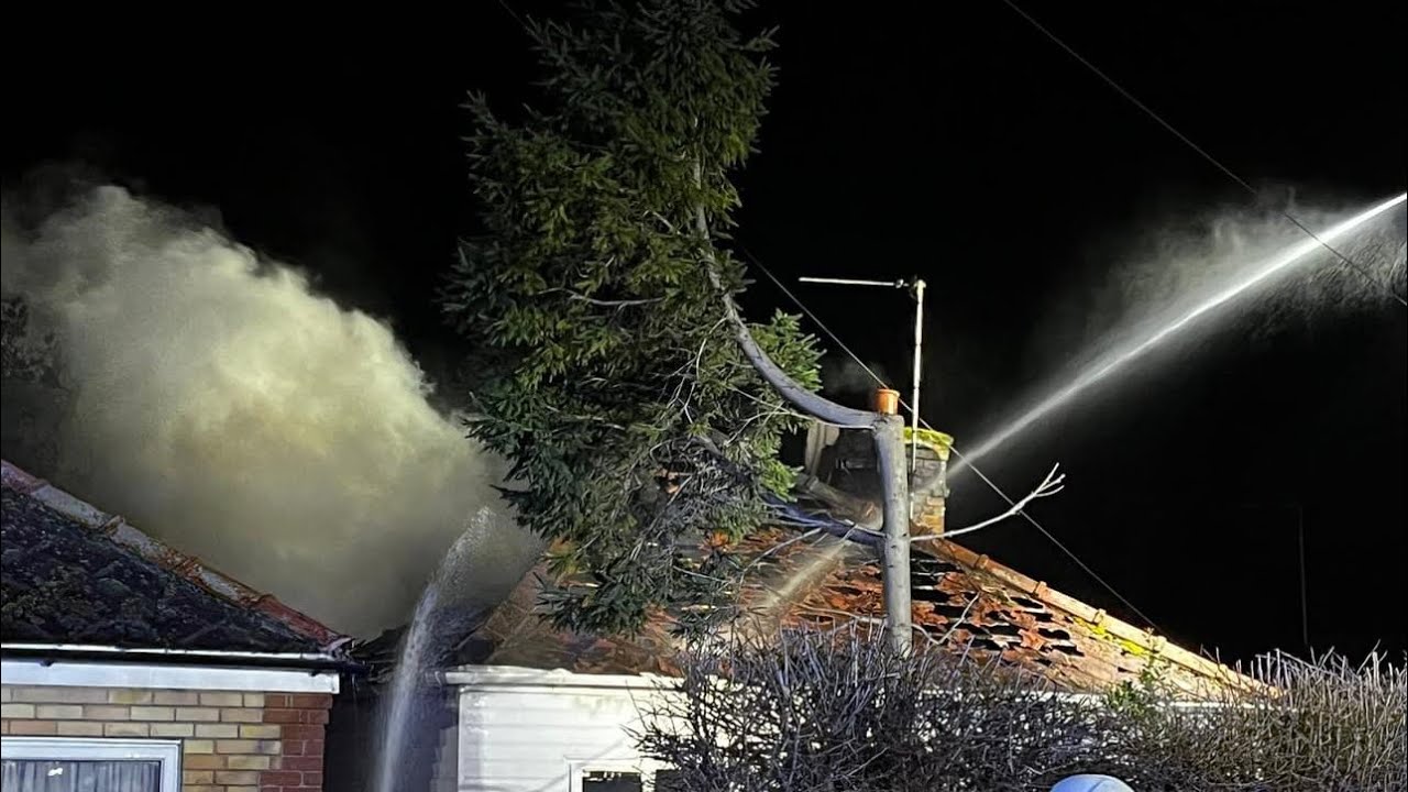 Homes evacuated as fire crews called to bungalow fire - YouTube