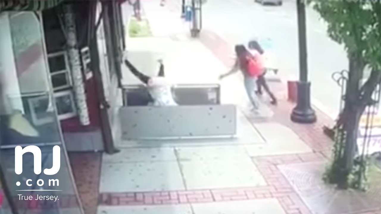 Woman falls into open sidewalk doors in Plainfield - YouTube