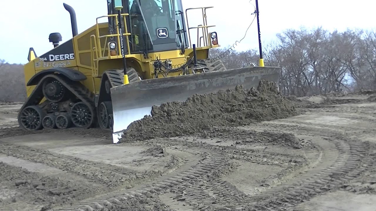 Leica's Dual Mast Dozer System grading up a slope - YouTube