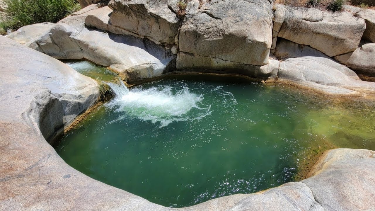 A natural rock hole through which river water passes. - YouTube