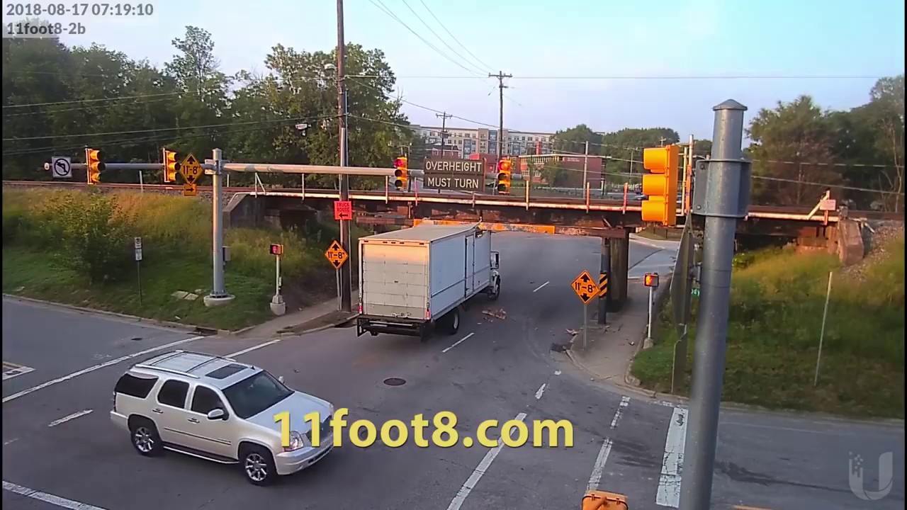 Red light runner crashes Big truck into the 11foot8 bridge - YouTube
