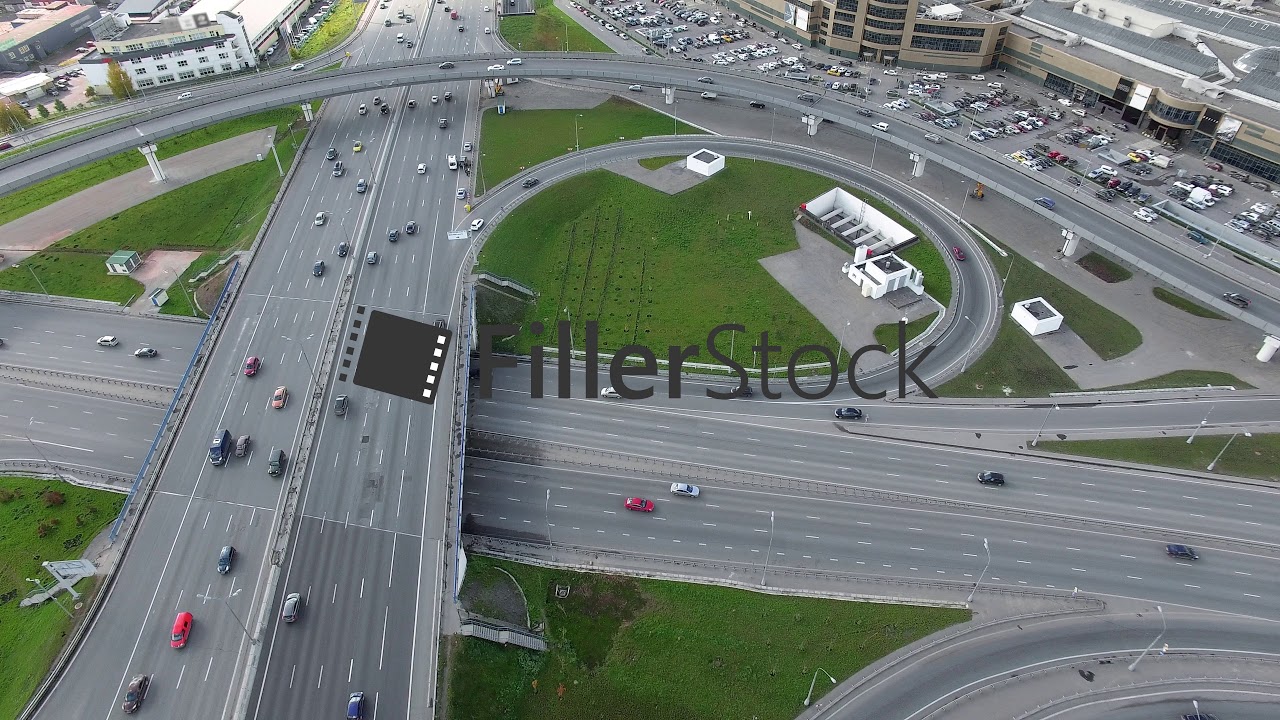 An aerial view of a large road junction close to the open parking lot ...