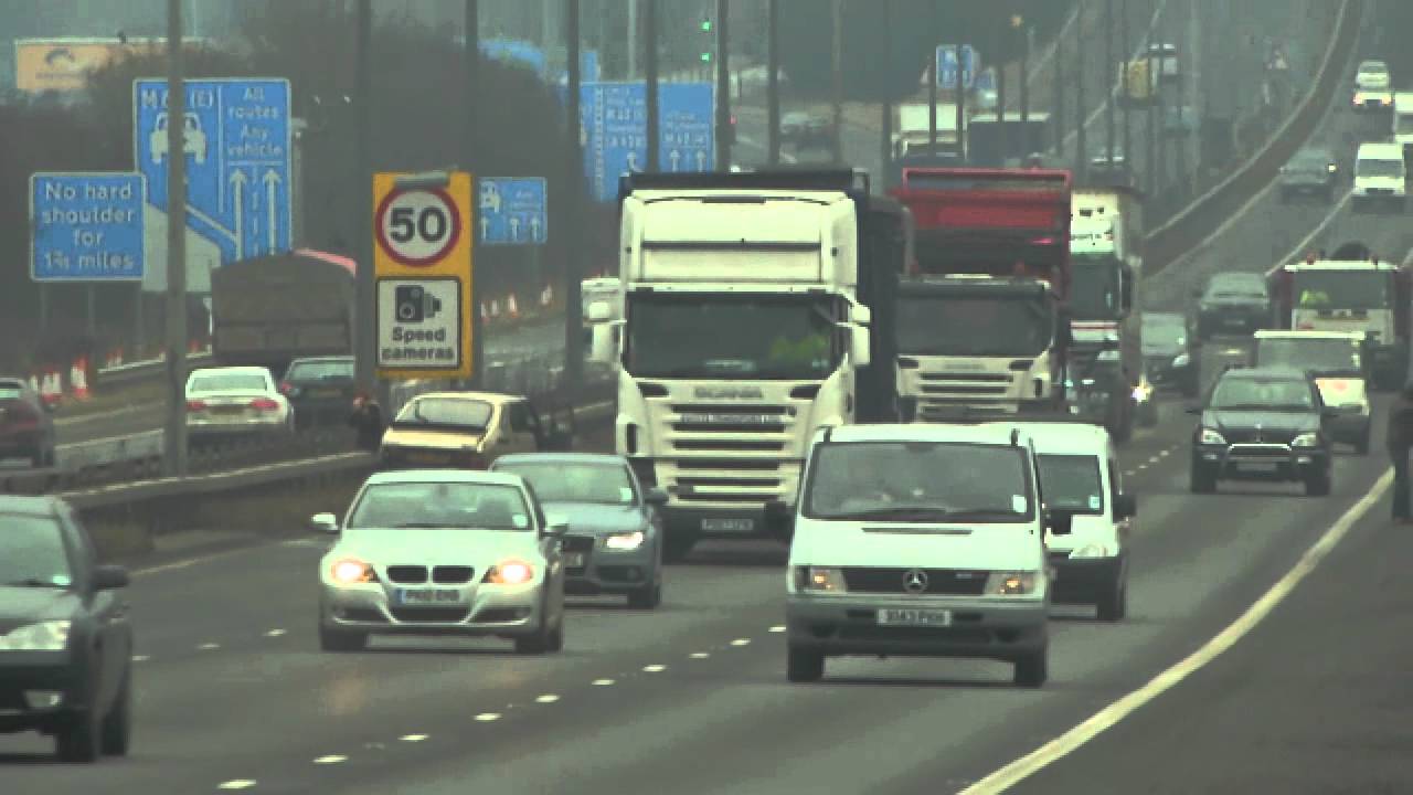 Woman stranded facing on-coming traffic on fast lane of motorway after ...
