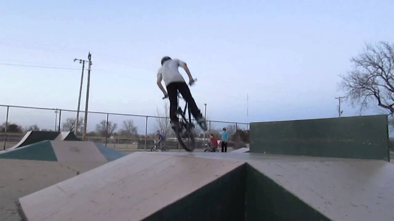 180 sick bike trick at skate park - YouTube