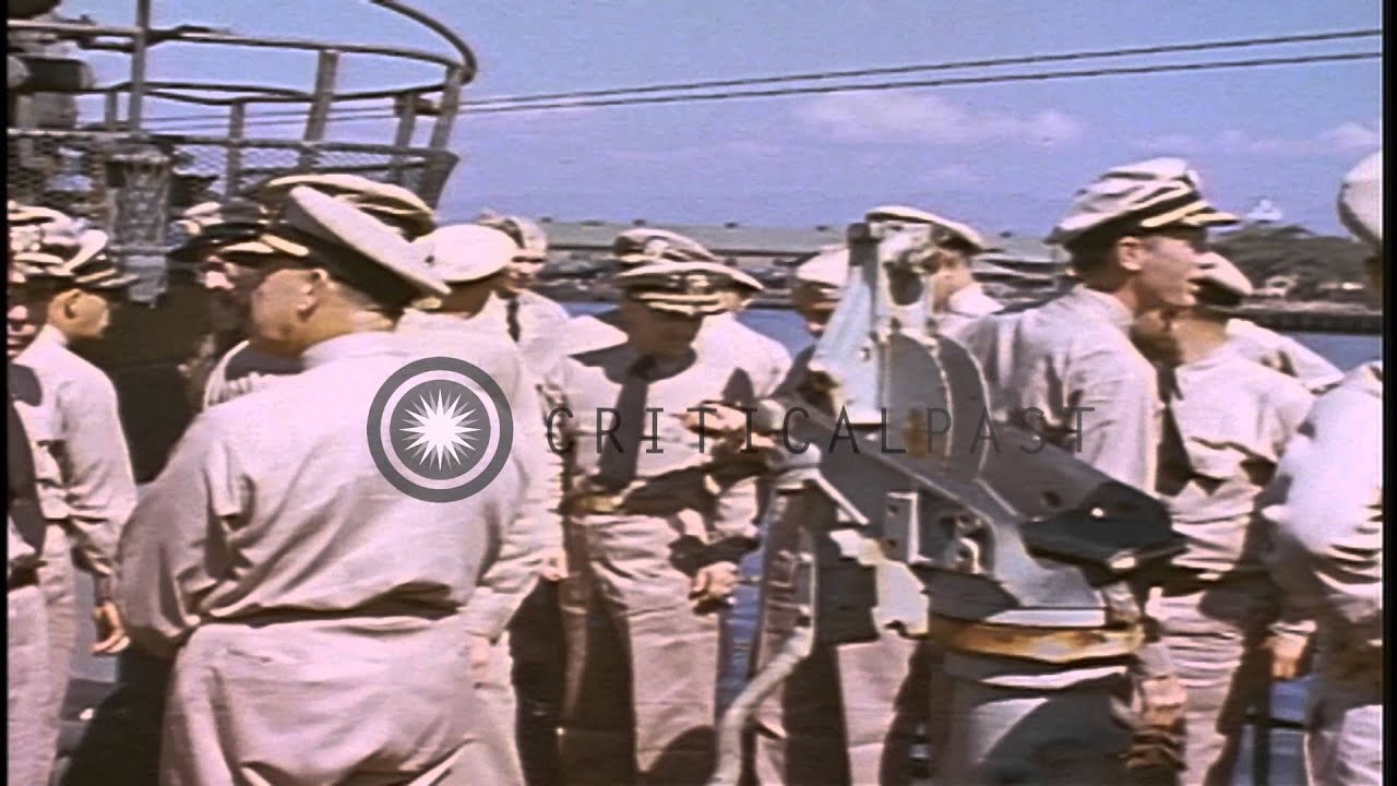 Officers greeting and discussing with each other at the deck of the USS ...