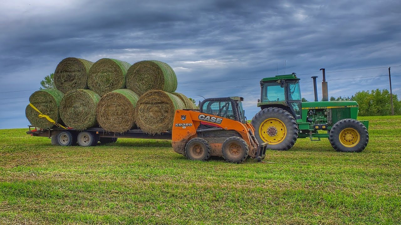 Hauling Round Bales - YouTube