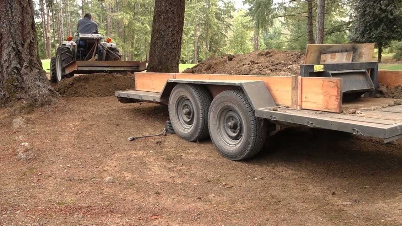 Unloading Dirt from Trailer - YouTube