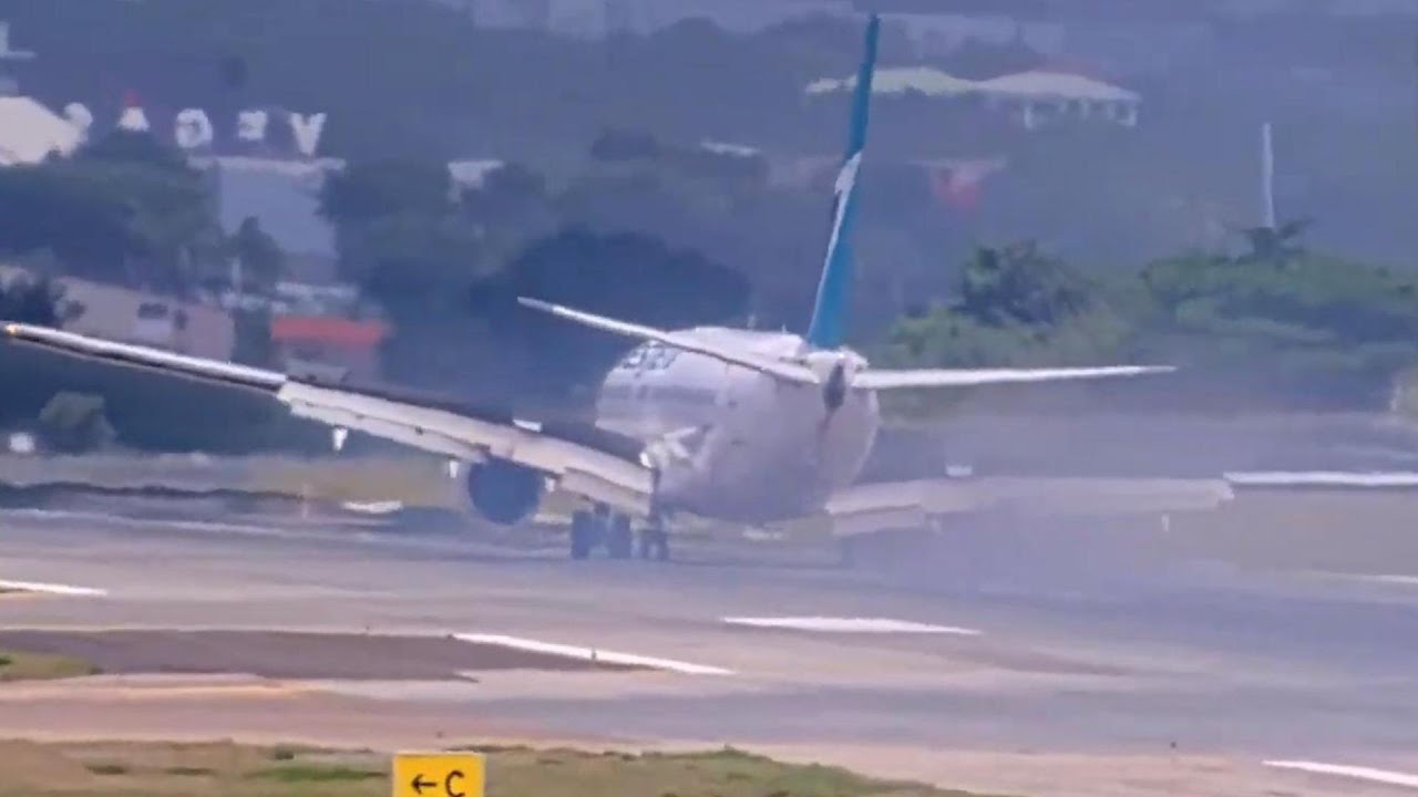 Runway Horror: WestJet 737-800 Gear Collapse at St. Maarten! - YouTube