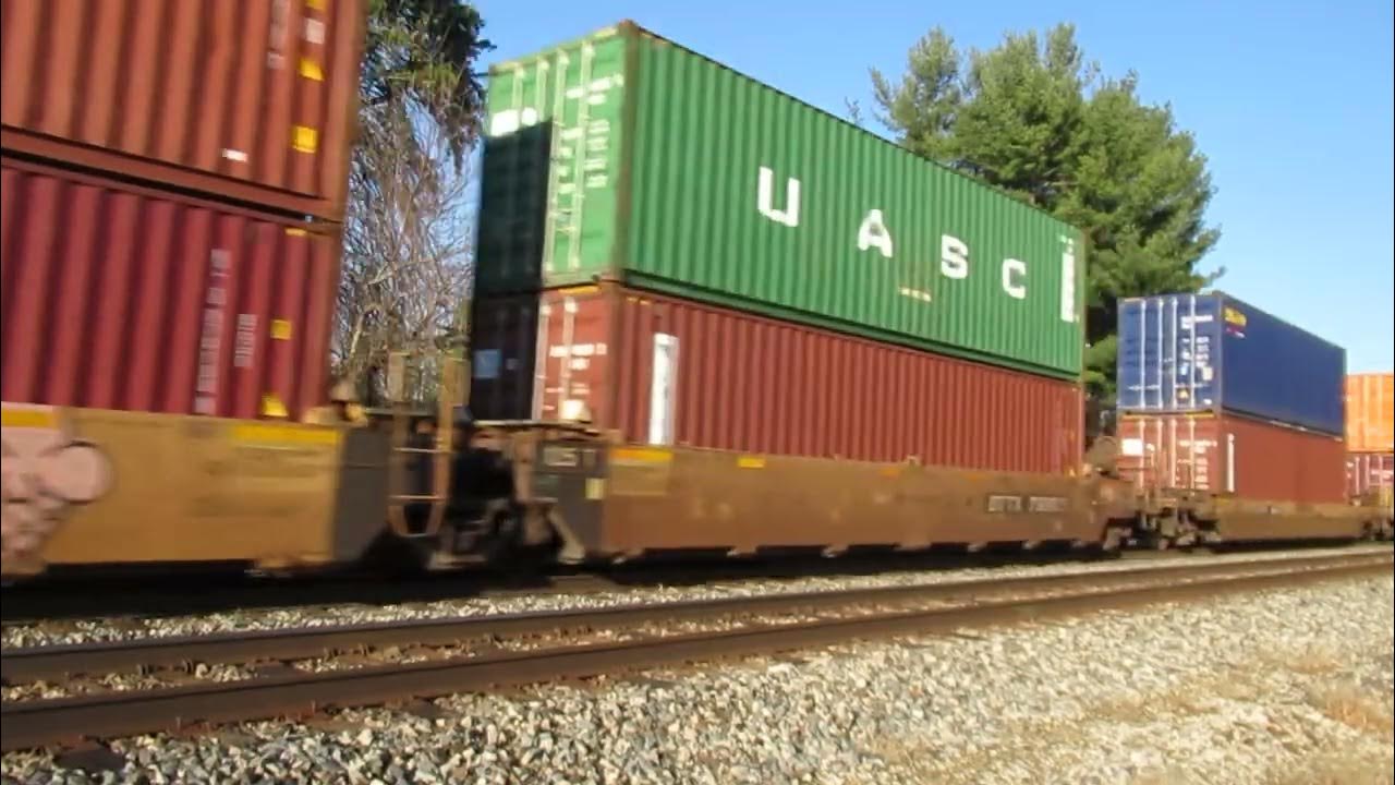 CN 5620, 8023, 5728, 2660 speed a Westbound container in well car freight train past Vicksburg ...