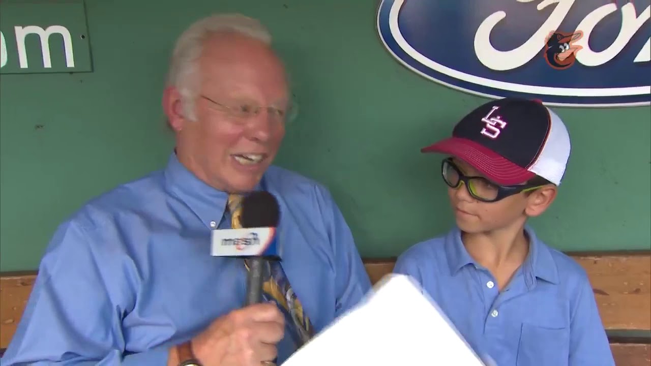 Henry Frasca, the 9 years old fan helps Orioles' Chris Davis with a ...