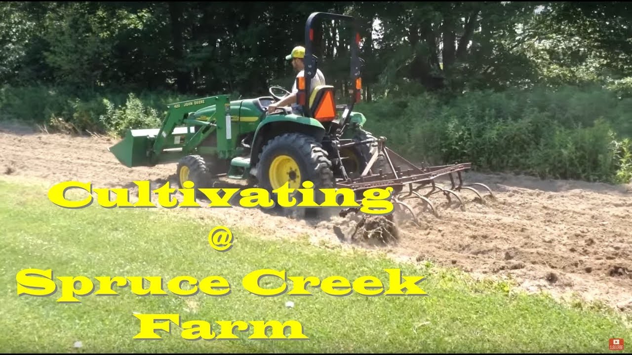 Cultivating with John Deere Compact Tractor. - YouTube