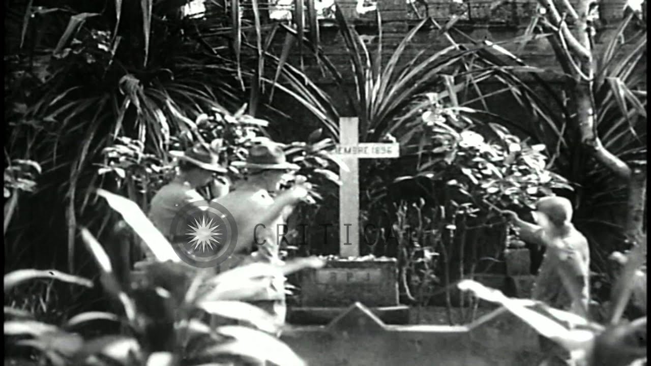 Grave of Dr Jose Rizal and fishing boats dock in harbor, Manila ...
