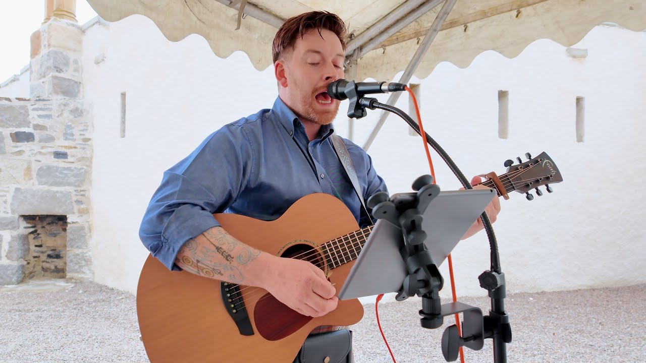 Nick Innes performing humorous song "La-di-dum" at opening of Braemar ...