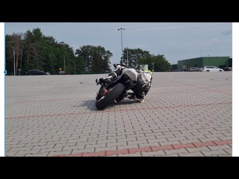 track motorcycle knee down / body position practice in a parking lot ...
