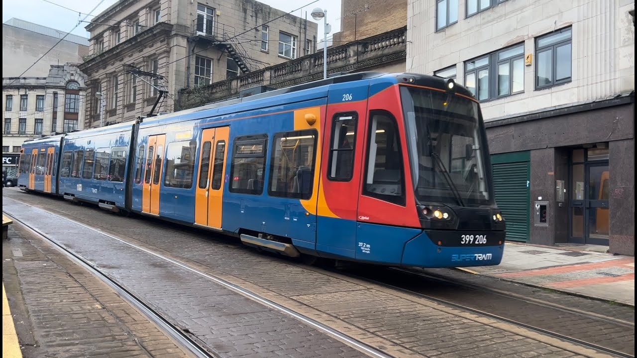 Sheffield Tram-Train 206 departs Ponds Forge with a Blue Route Service ...