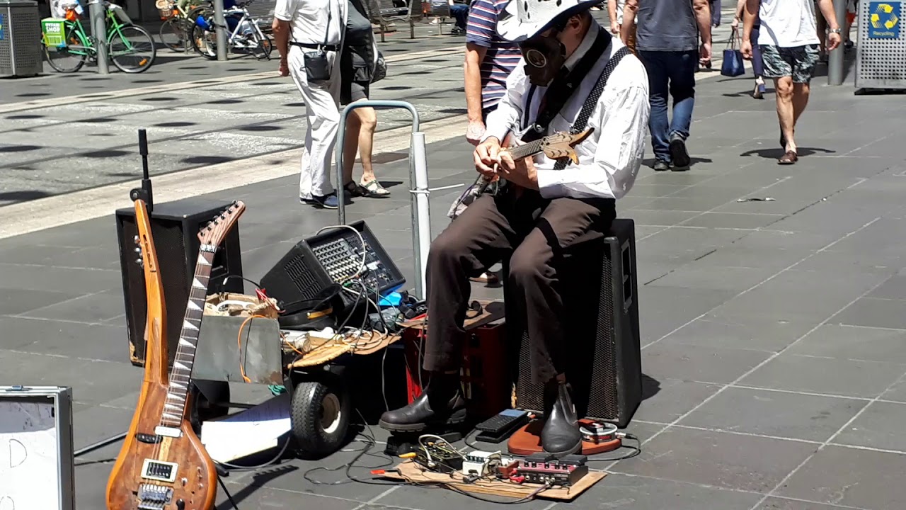 Angus young busking in Melbourne Australia... - YouTube