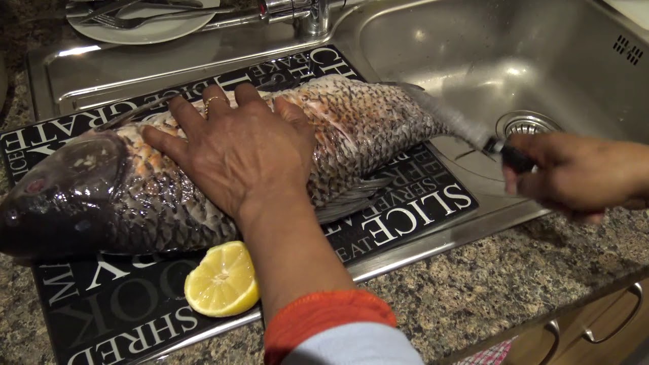 SEASONING AND GRILLING THE FESTIVE FISH - YouTube