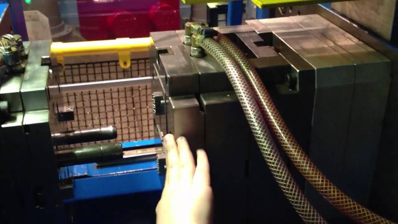 Renate explains Lego injection molding process - YouTube