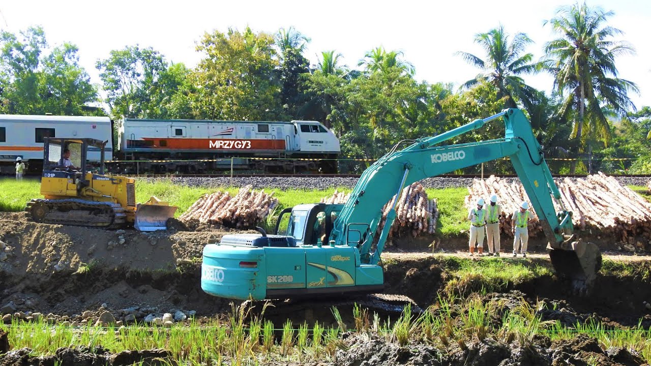 Excavator Digging Old Farm Field - YouTube
