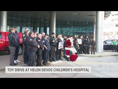 Local first responders deliver toys to Helen DeVos Children's Hospital ...