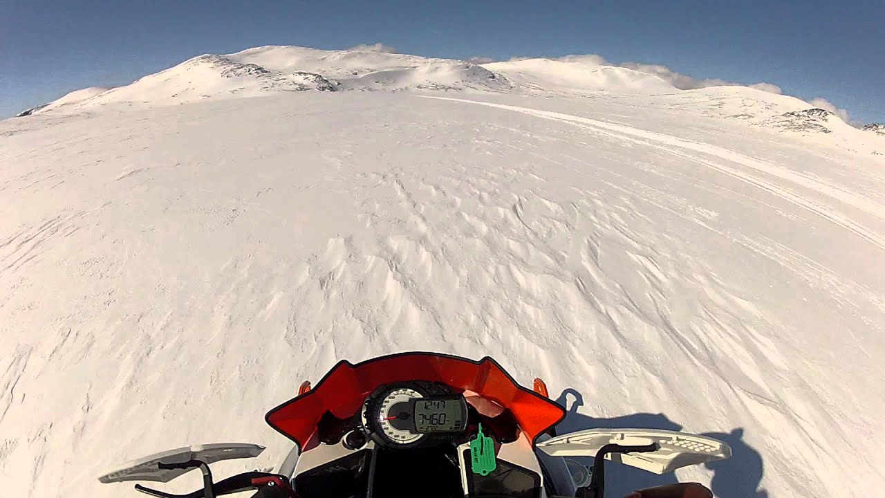 Arctic cat XF 1100 speeding over frozen landscape - YouTube
