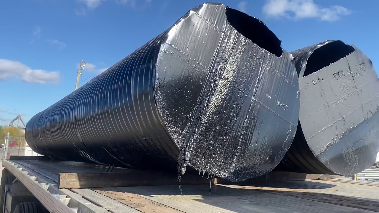 Trucking , Hauling 3 culvert pipes dipped and filled with tar . - YouTube
