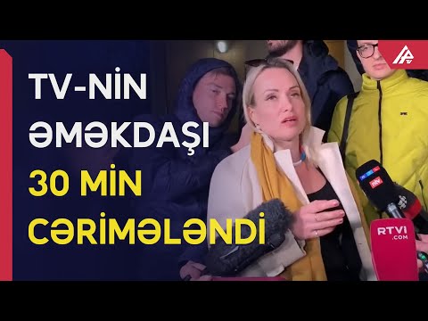 Canlı yayımda plakat tutan əməkdaş mediaya danışdı