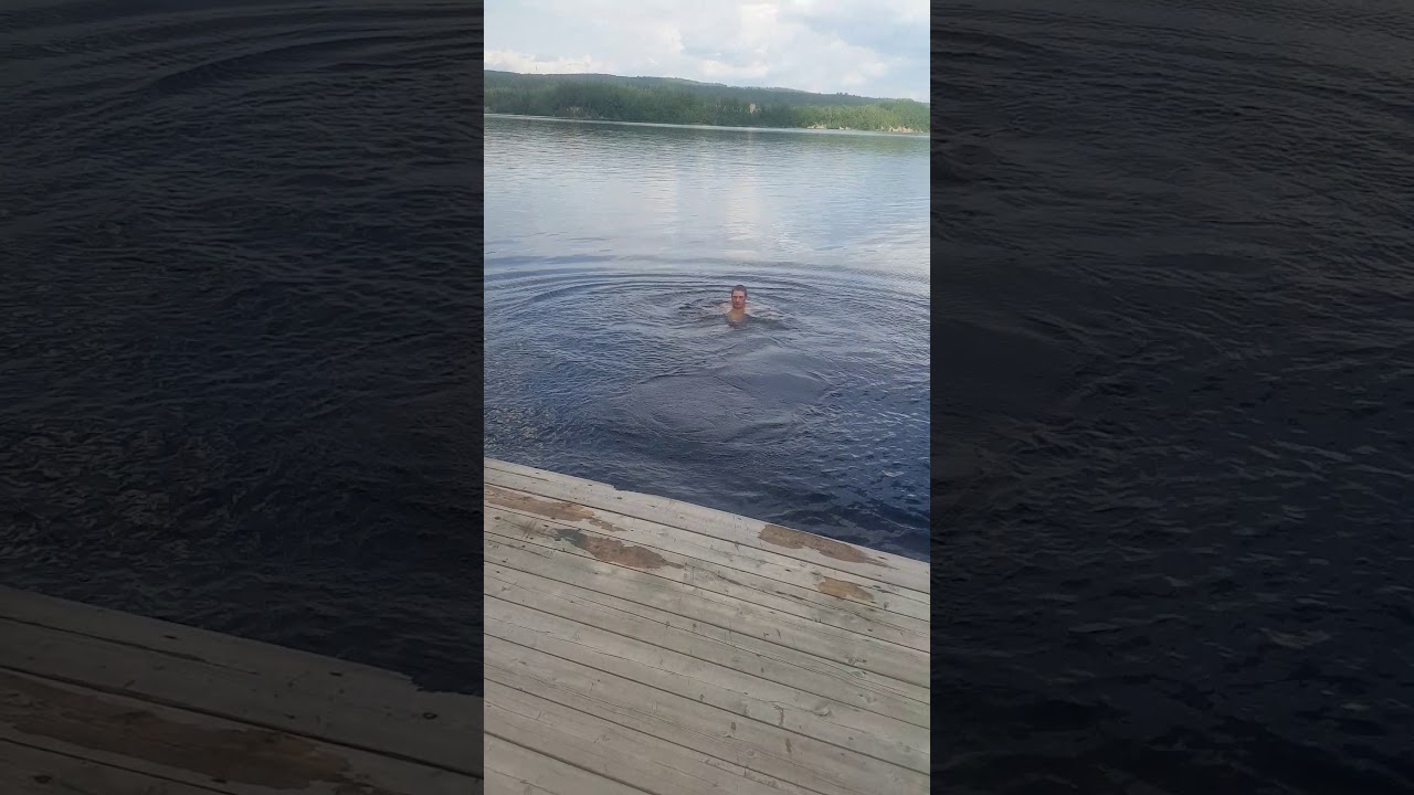 Dude swimming in jeans - YouTube