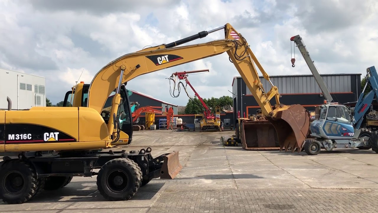 Caterpillar M316C - YouTube