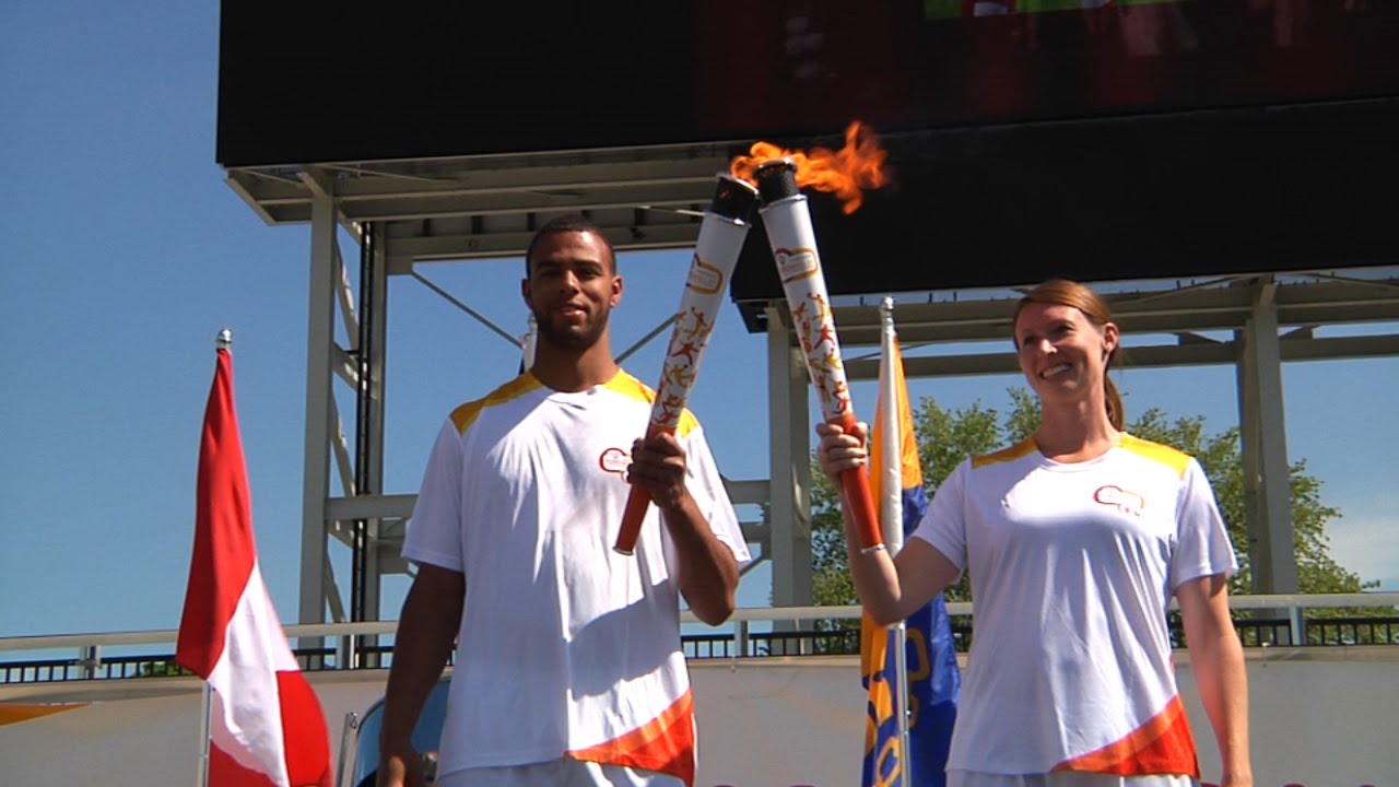 Pan Am Torch arrives at Hamilton Stadium - YouTube