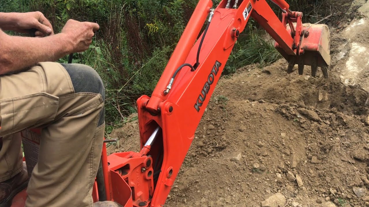 using a SMALL back hoe to do BIGGER jobs (kabota bh75) - YouTube