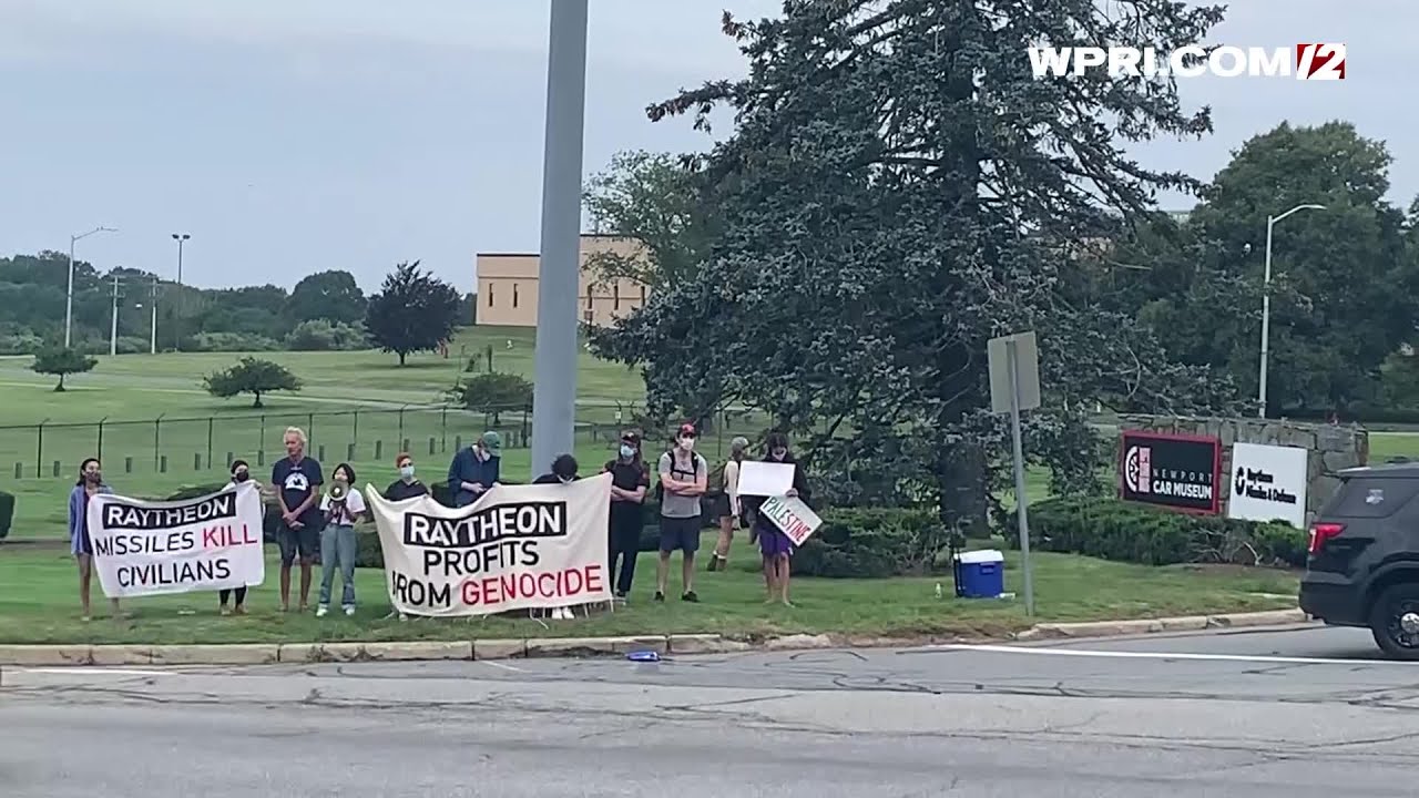 VIDEO NOW: Protestors block entrance to Raytheon - YouTube